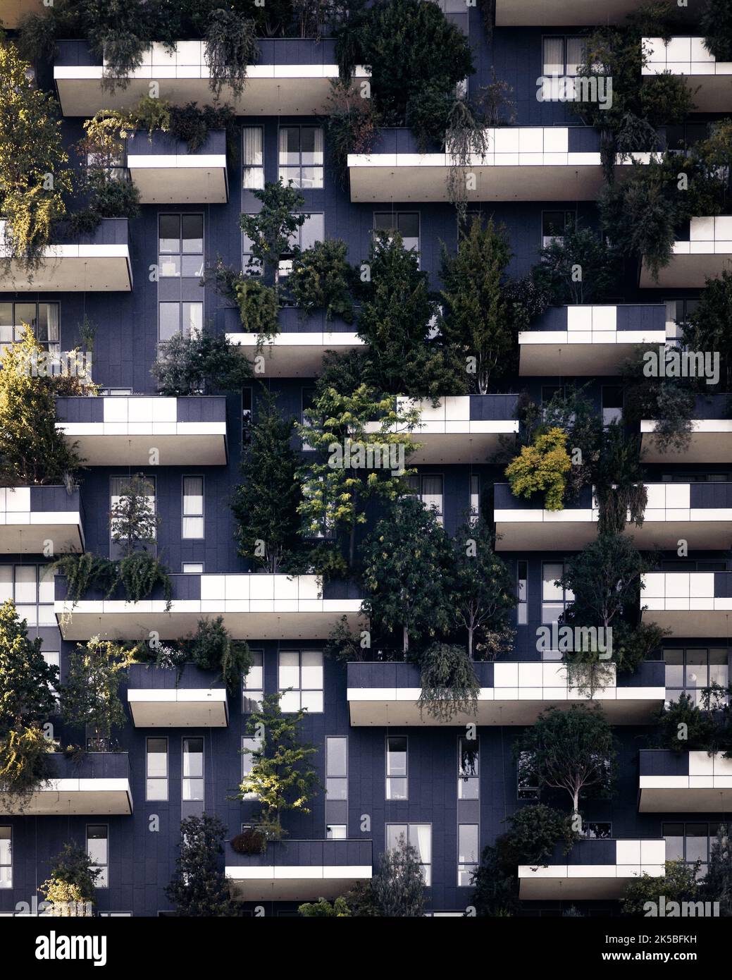 The beautiful balconies with trees and plants on the exterior of a ...
