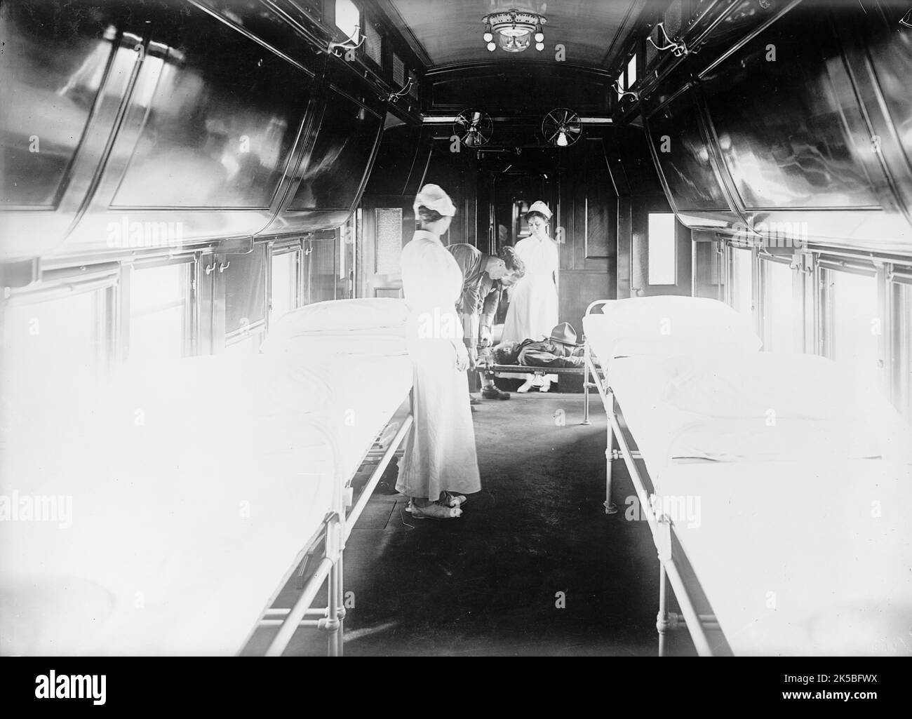Army, U.S, Hospital Car - Interior, 1917. Soldier is stretchered on ...