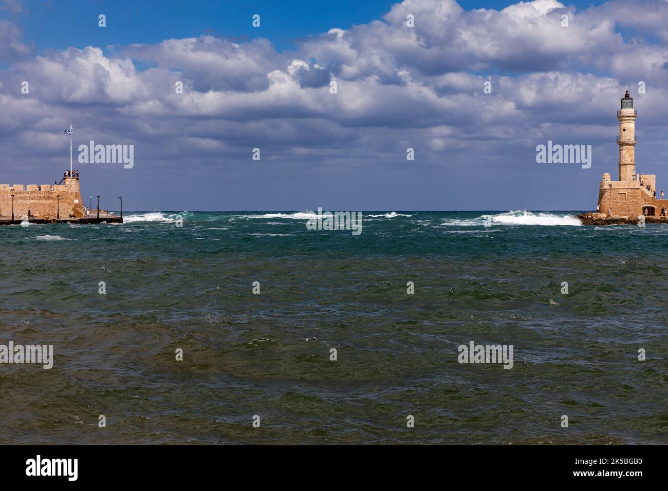 High waves on the promenade in the Venetian harbor of Chania, Crete ...