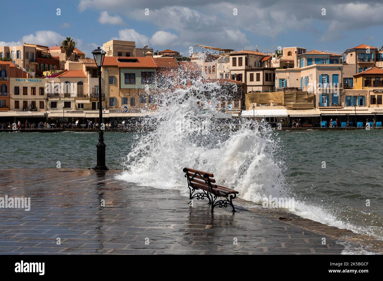 High waves on the promenade in the Venetian harbor of Chania, Crete ...
