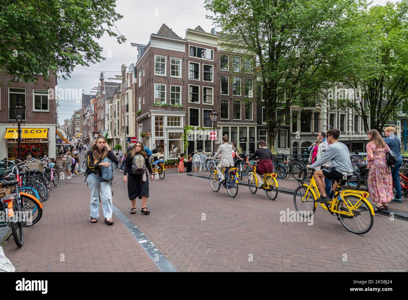 Cozy street for tourists and residents in the center of Amsterdam Stock ...