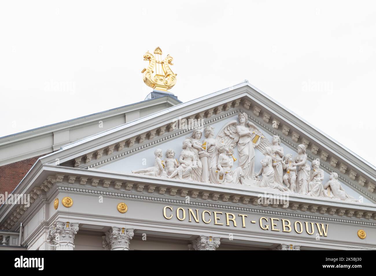 Royal concert hall with the tympanum on the facade with religious ...