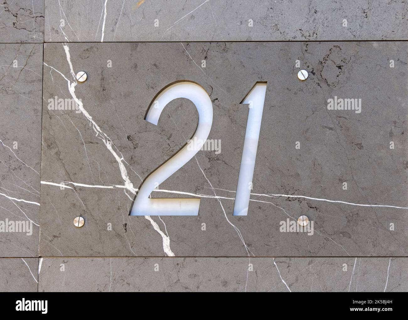 Engraved Number Twenty One at Marble Tile Stone Wall Stock Photo - Alamy