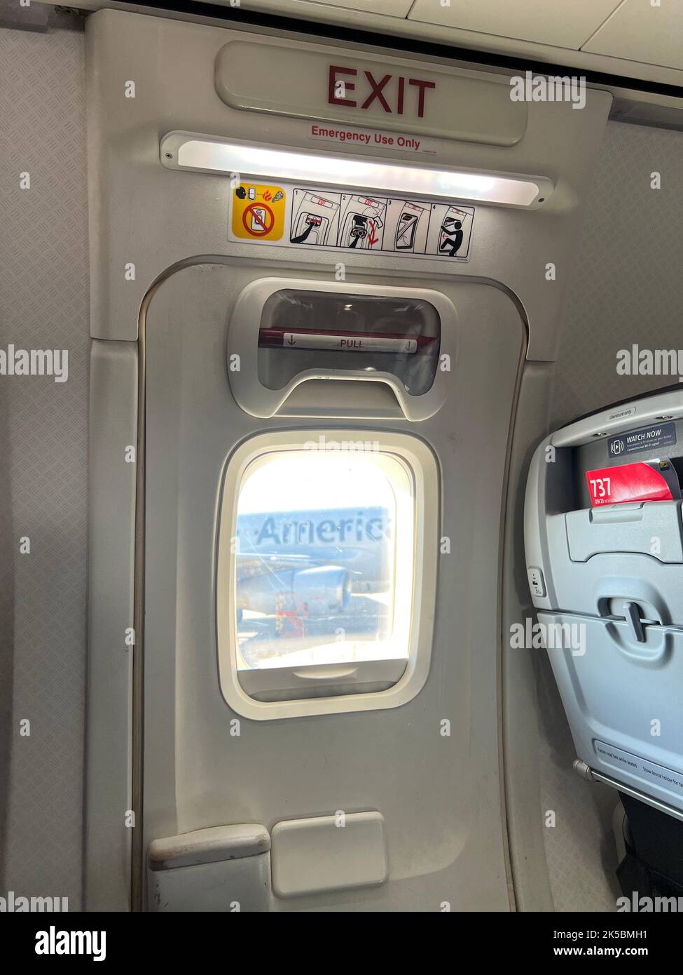 Emergency exit door inside an American Airlines aircraft parked at the ...
