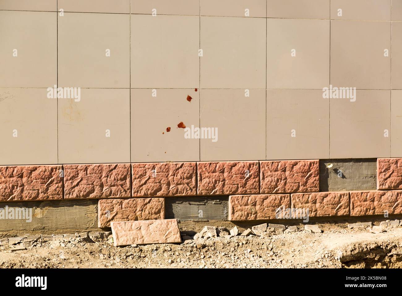 Decorative facing stone falls off from the wall of the building Stock ...