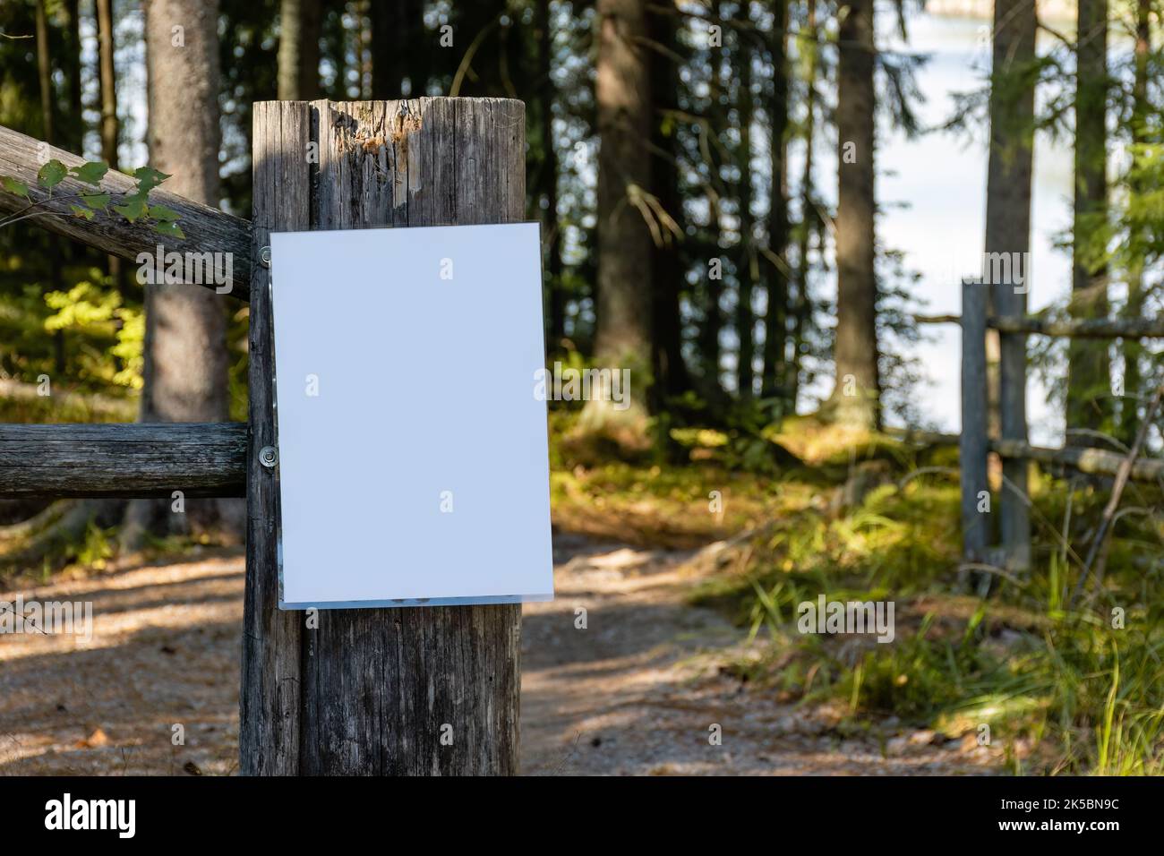 Close up of empty white sign on a wooden fence post in the woods Stock ...