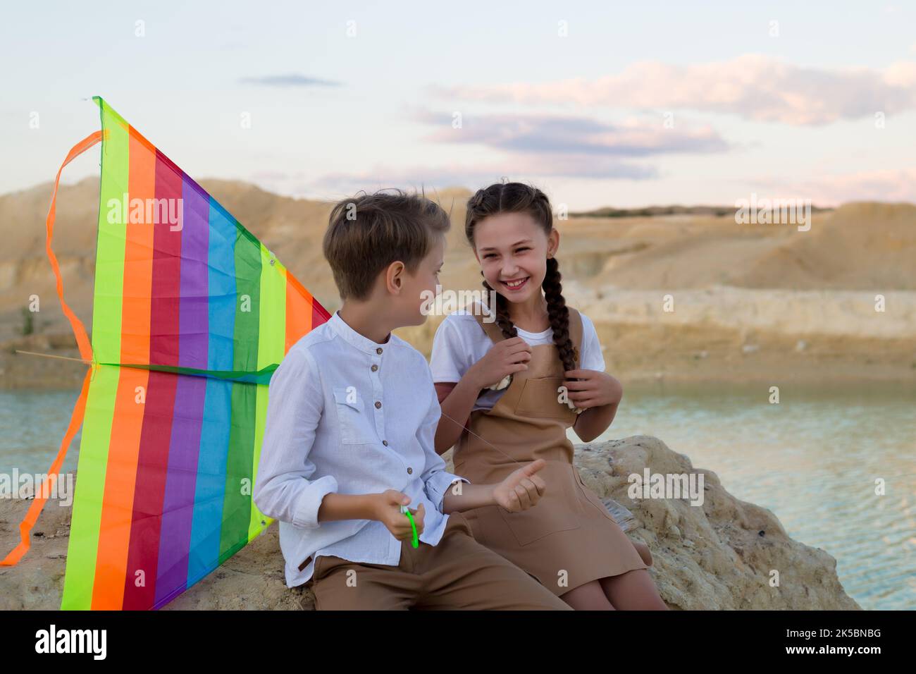 Brother and sister talking to each other, sharing the latest news Stock ...