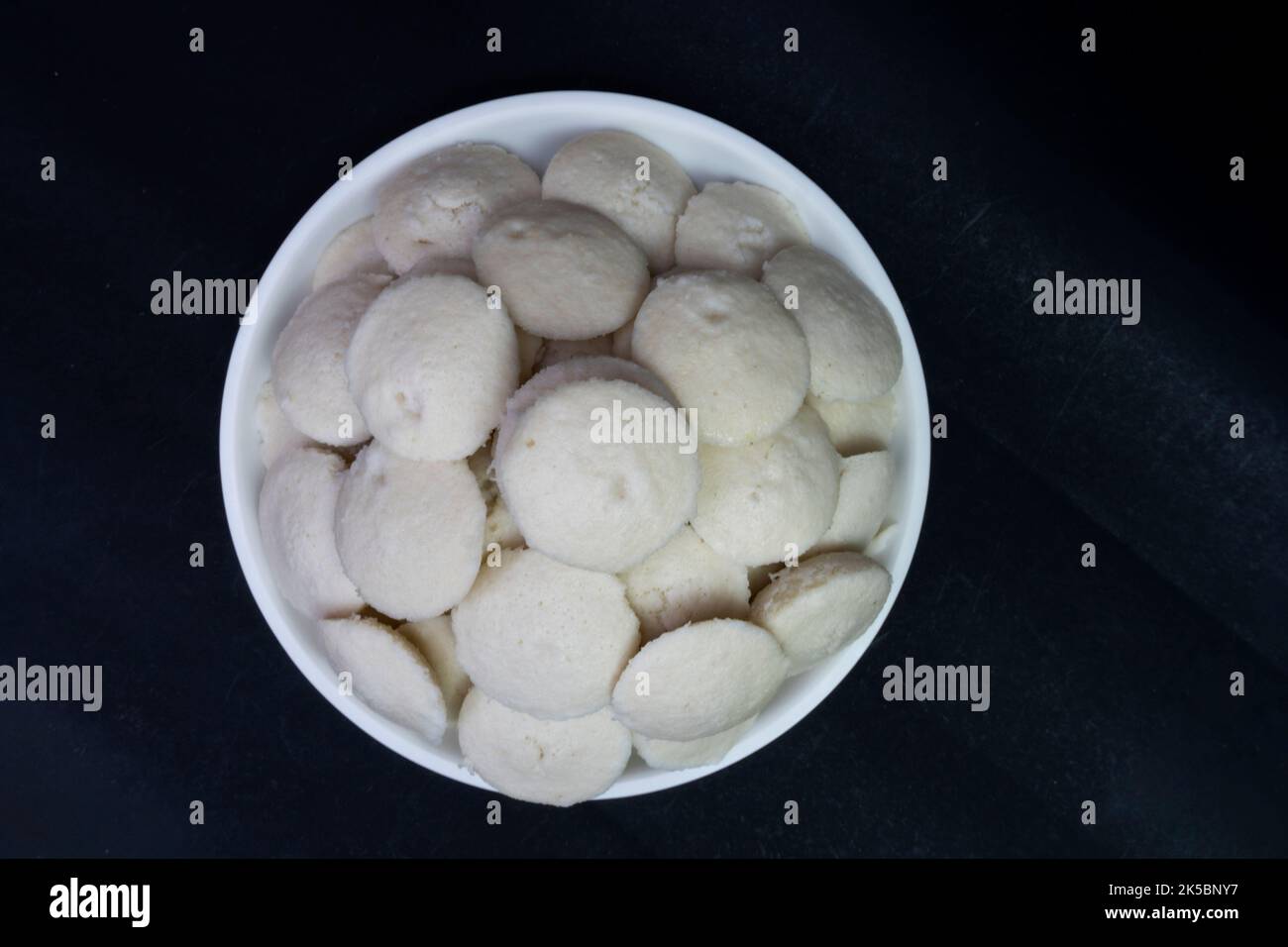 Idly In White Plate With Sambar In Red Bowl, Isolated On Black ...
