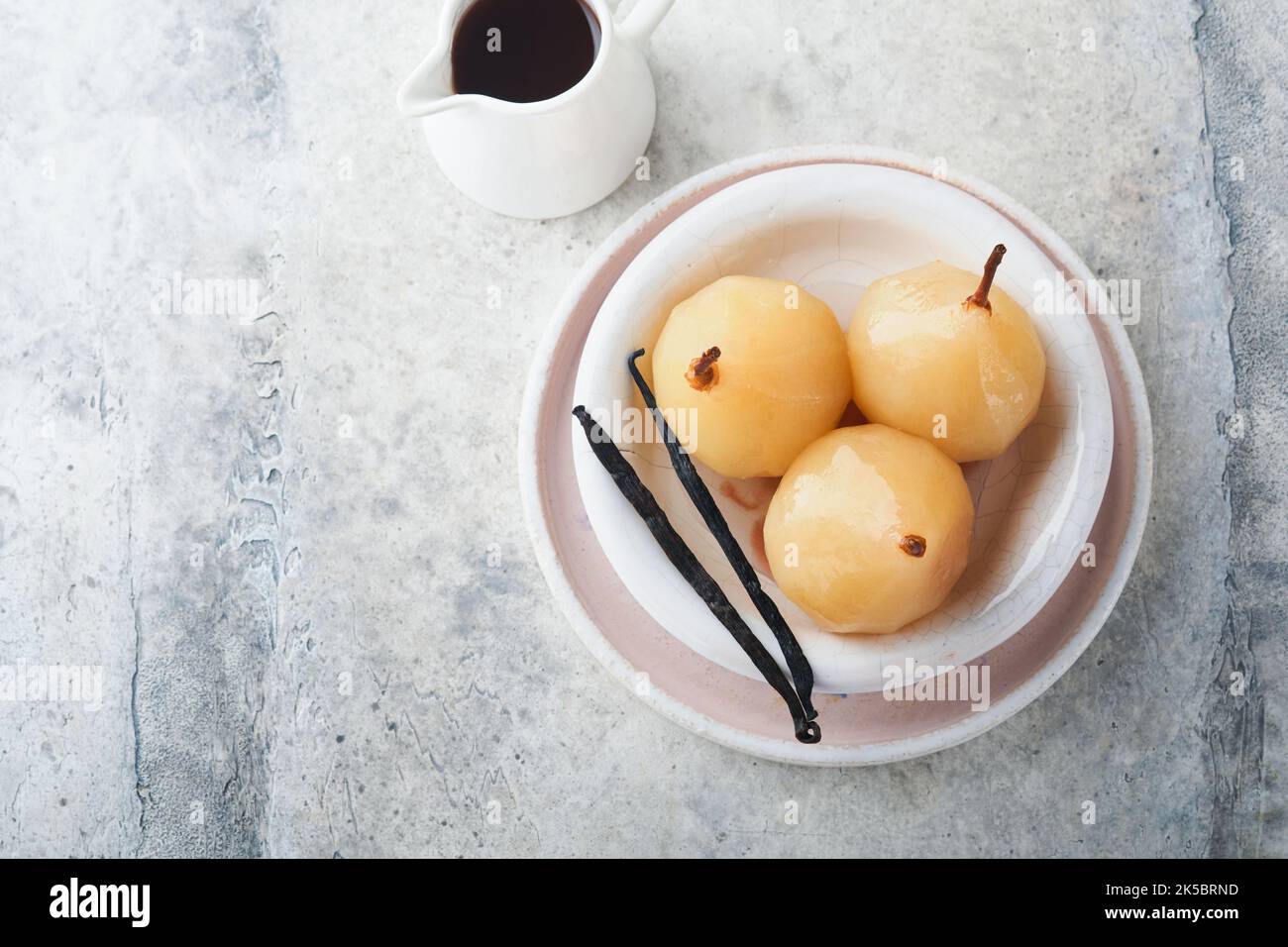 Pears. Poached pears in syrup. Traditional dessert sliced server in a ...