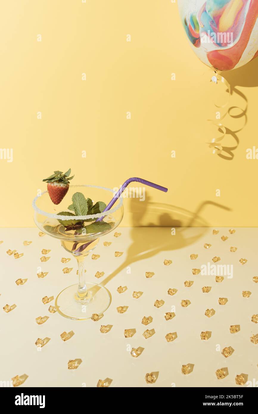 A cocktail party scene against a yellow background Stock Photo - Alamy