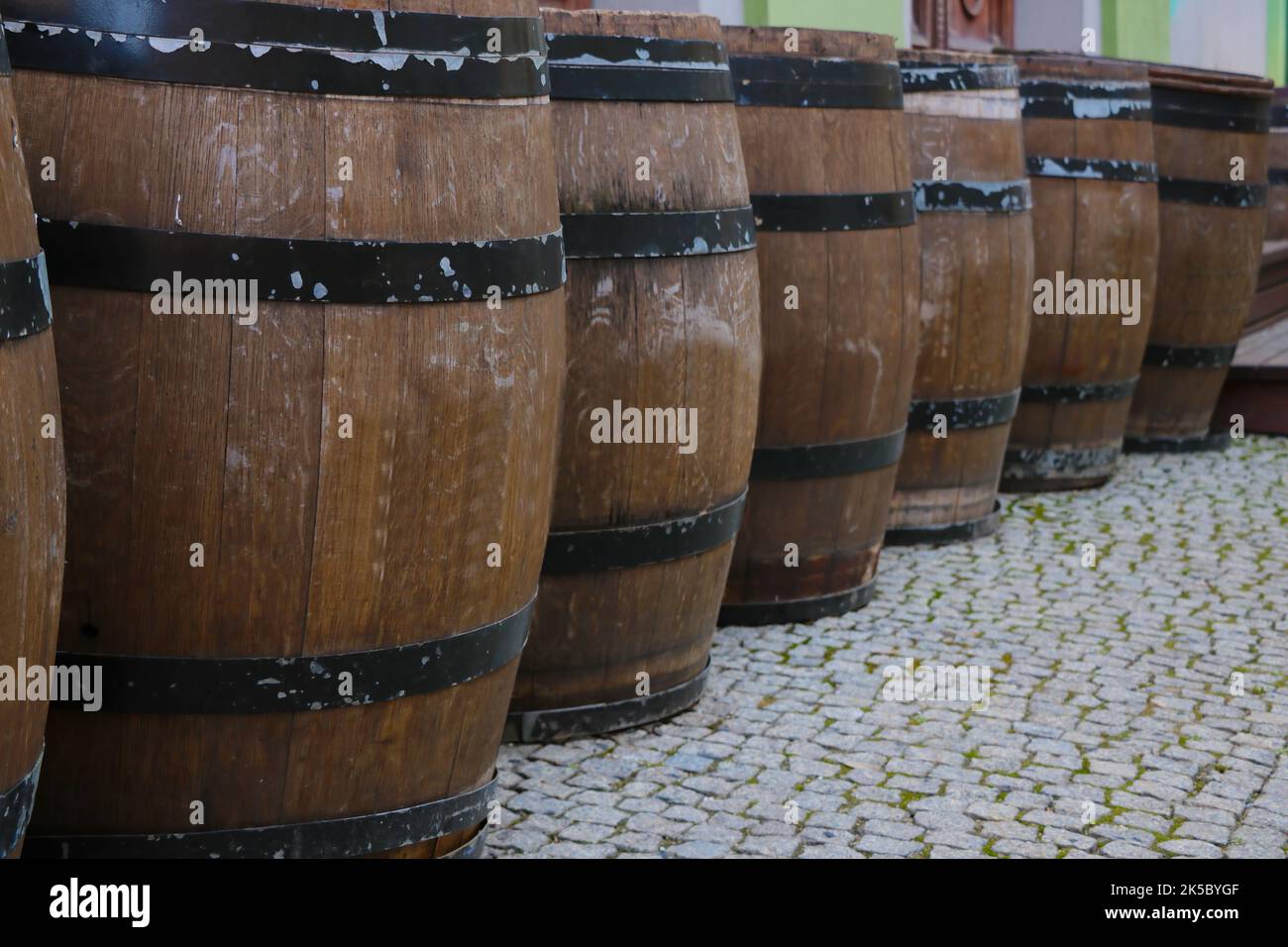 A row of barrels for storing wine and other alcohol in closeup Stock ...