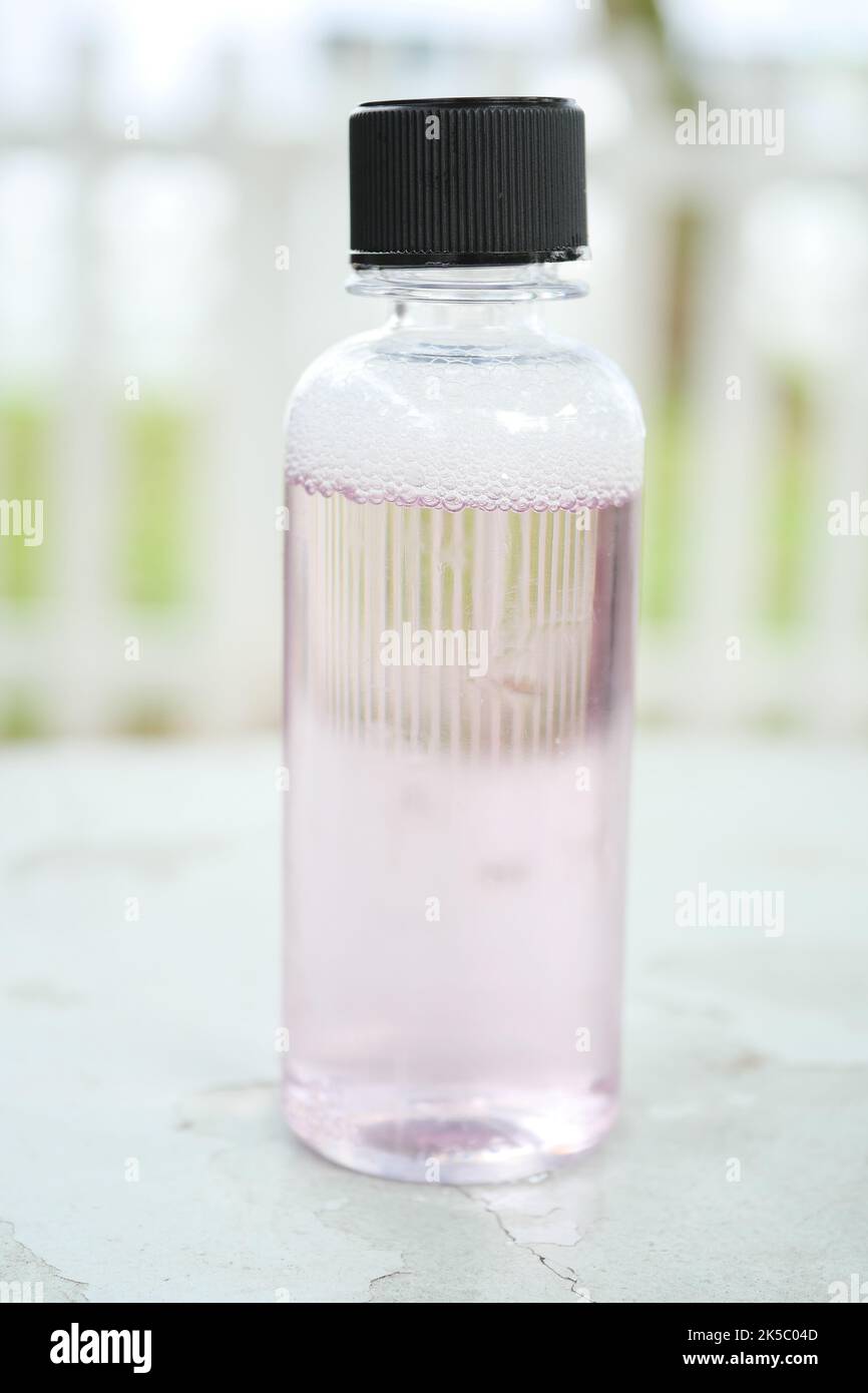 mouthwash liquid in a container on table Stock Photo - Alamy