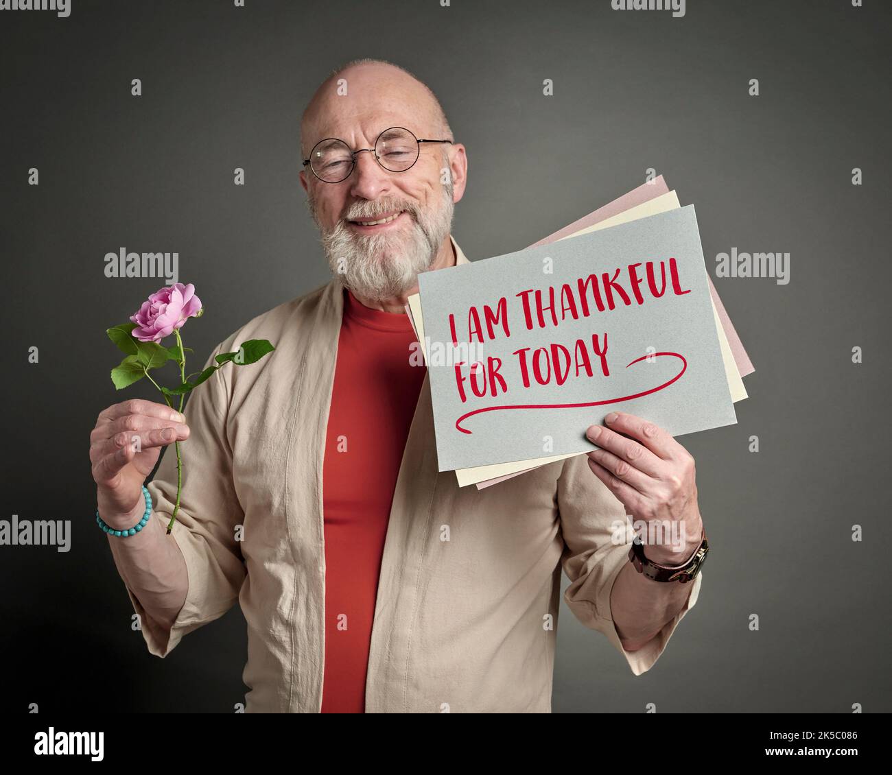 I am thankful for today - a senior smiling senior man with a ...