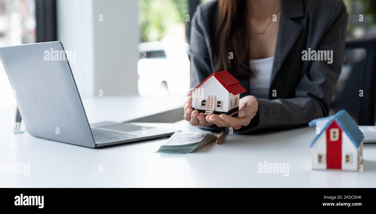 Portrait Of Beautiful Young Real Estate Agent Business Woman Holding House Keys And House Mockup