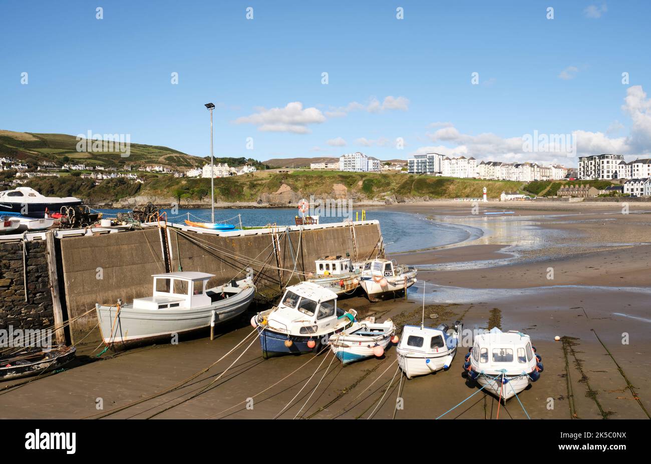 a view of the bay at Port Erin, Isle of Man with the lighthouse and ...
