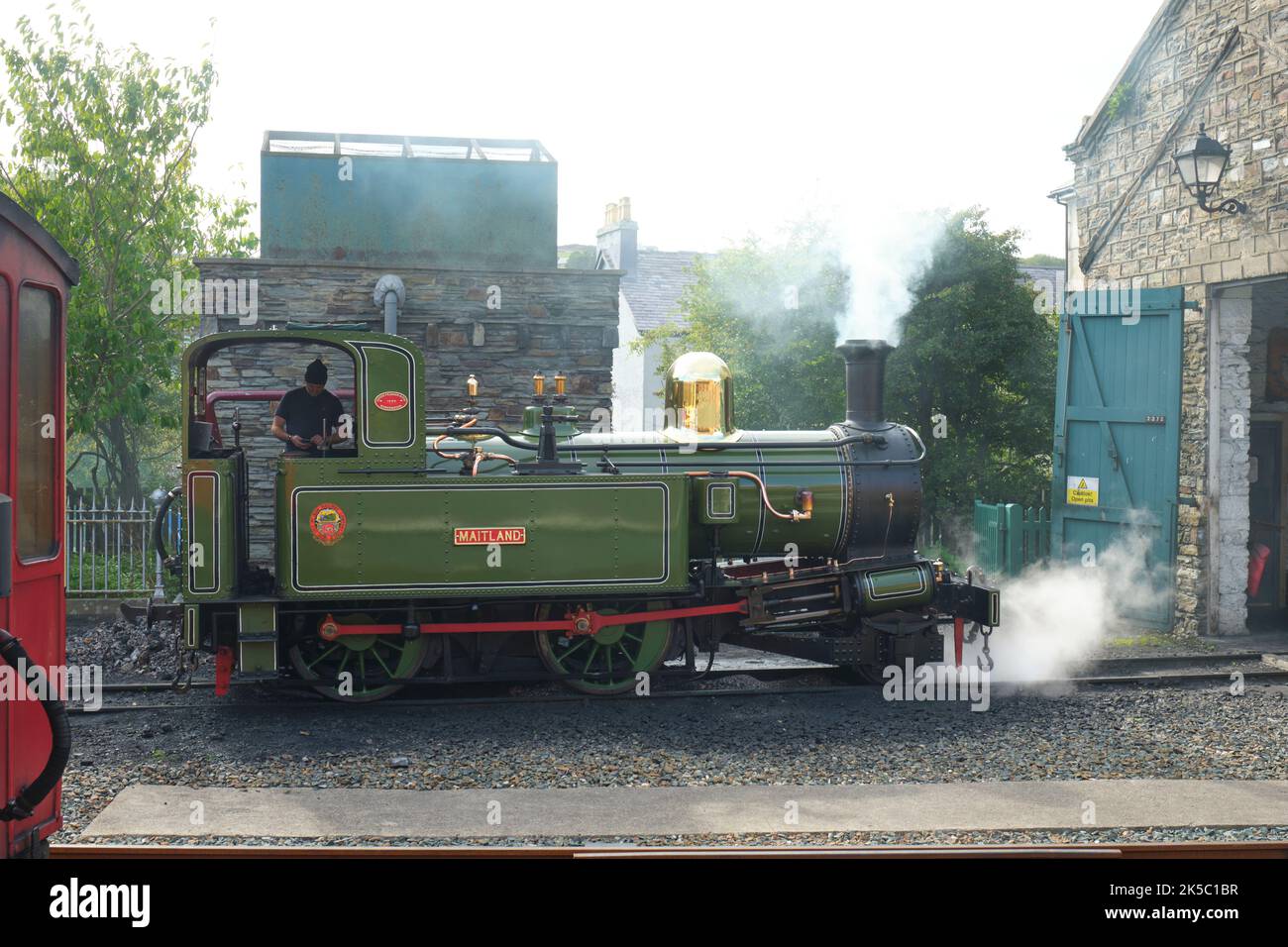 A narrow-gauge steam railway engine waiting in Port Erin station, Isle ...