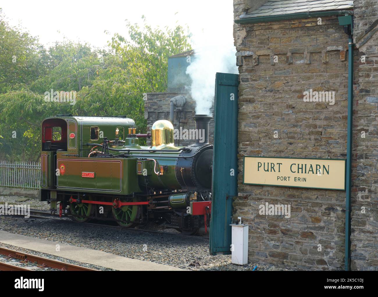 A narrow-gauge steam railway engine waiting in Port Erin station, Isle ...