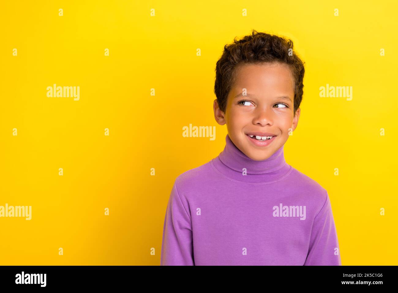Photo portrait of charming little boy smiling look tricky empty space ...