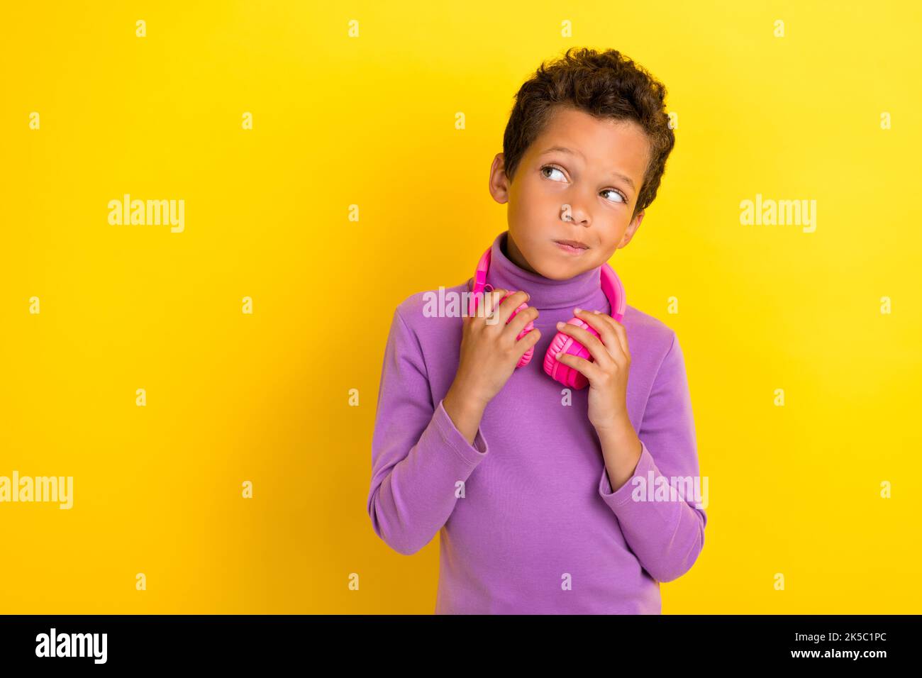 Photo of minded boy look interested empty space hesitate brainstorming ...