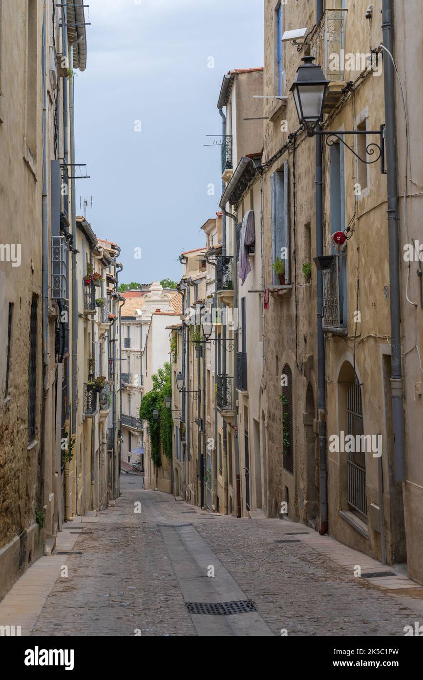 Scenic urban landscape view of typical narrow cobblestone street with ...