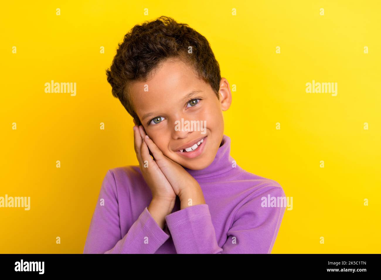 Photo of cheerful sweet schoolkid toothy smile arms under cheek ...