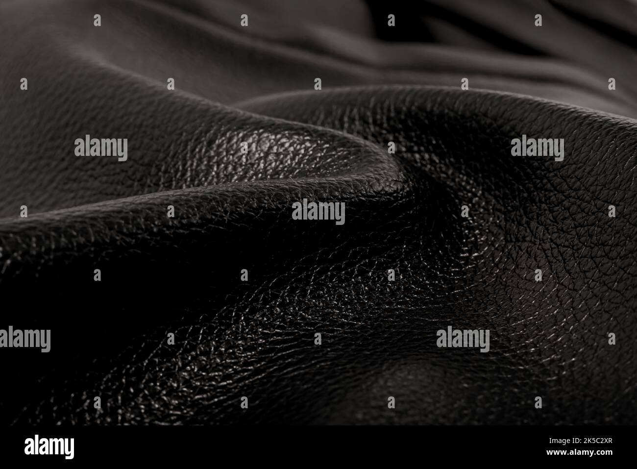 Black leather texture. Abstract background of dark leather with small ...