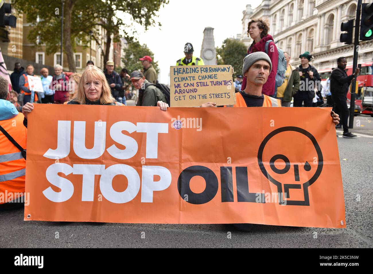 Protesters hold a banner expressing their opinion during the seated in ...