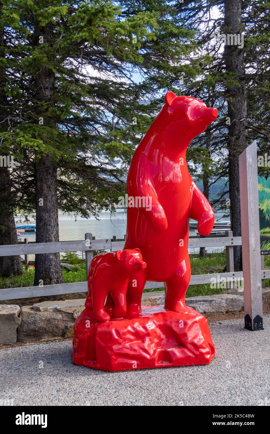 Waterton, Alberta, Canada - July 5, 2022: Red bear and cub statue at Waterton Lakes National ...