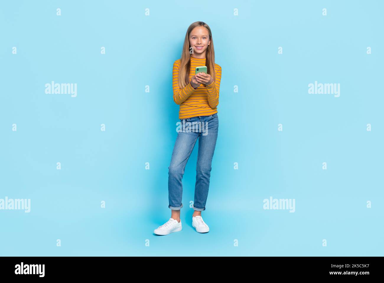 Full body photo of cheerful cute person hands hold use telephone ...