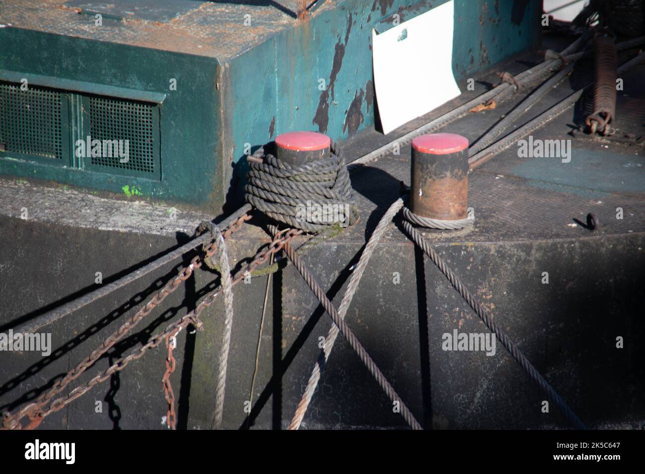 Ship is anchored to the quay with ropes Stock Photo - Alamy