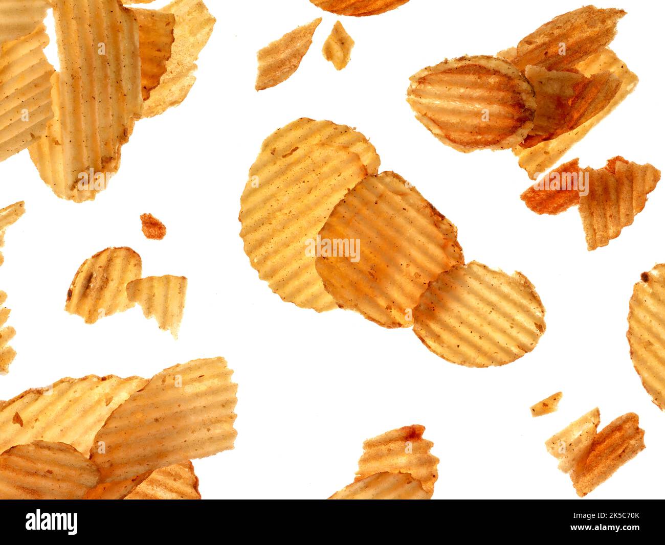 Clean background crinkle cut potato crisps in close up, food snack ...