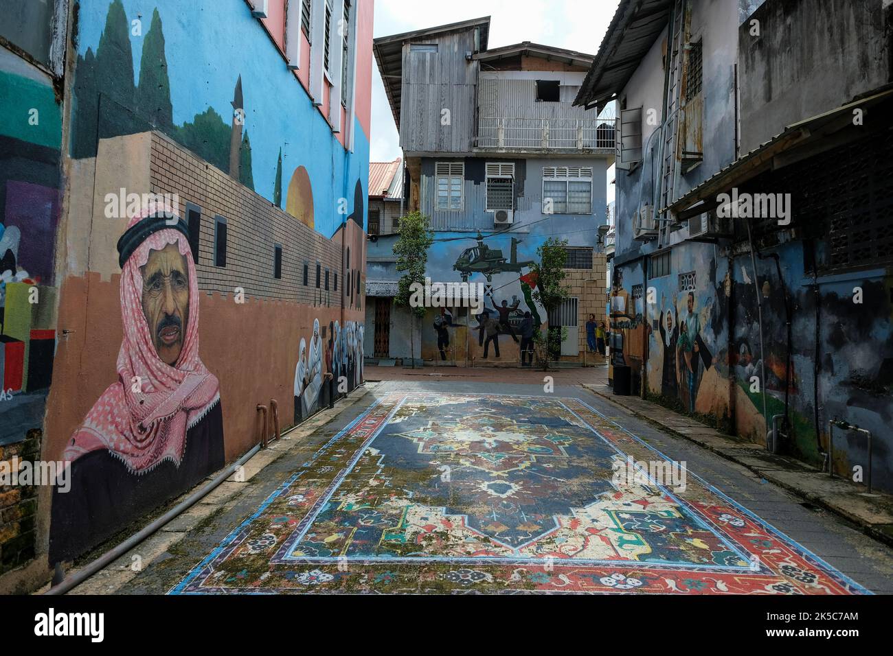 Kota Bharu, Malaysia - October 2022: Street with graffiti in the center ...