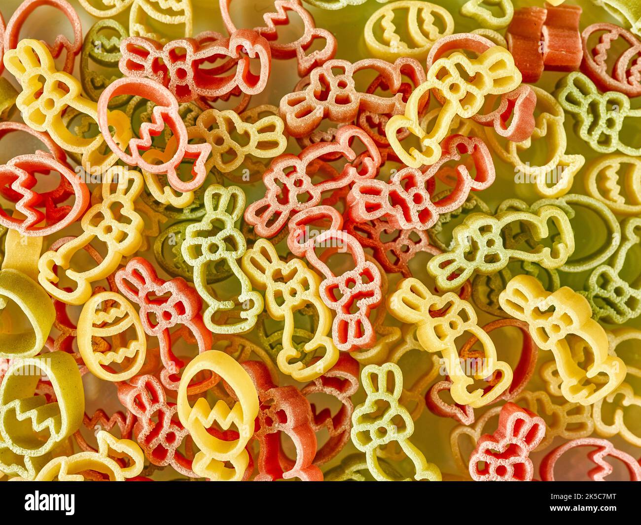 Food ingredient still-life of Tricolour, Easter Pasta Shapes in close ...