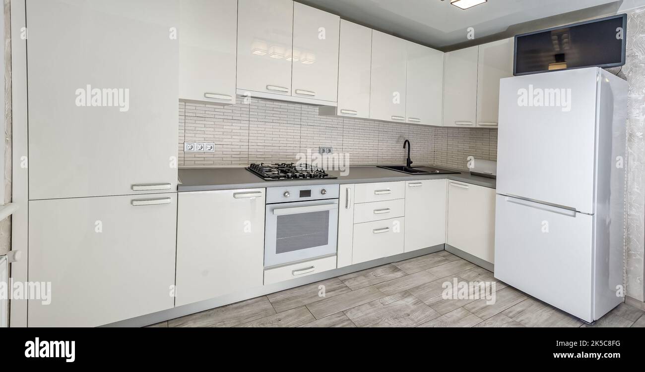 Corner white kitchen set Stock Photo - Alamy