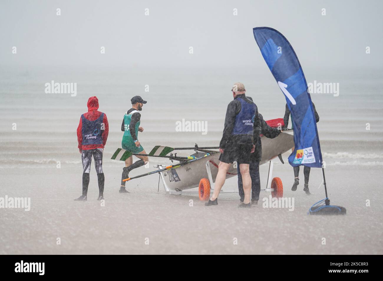France men's double skull team warms up in a rain storm during the ...