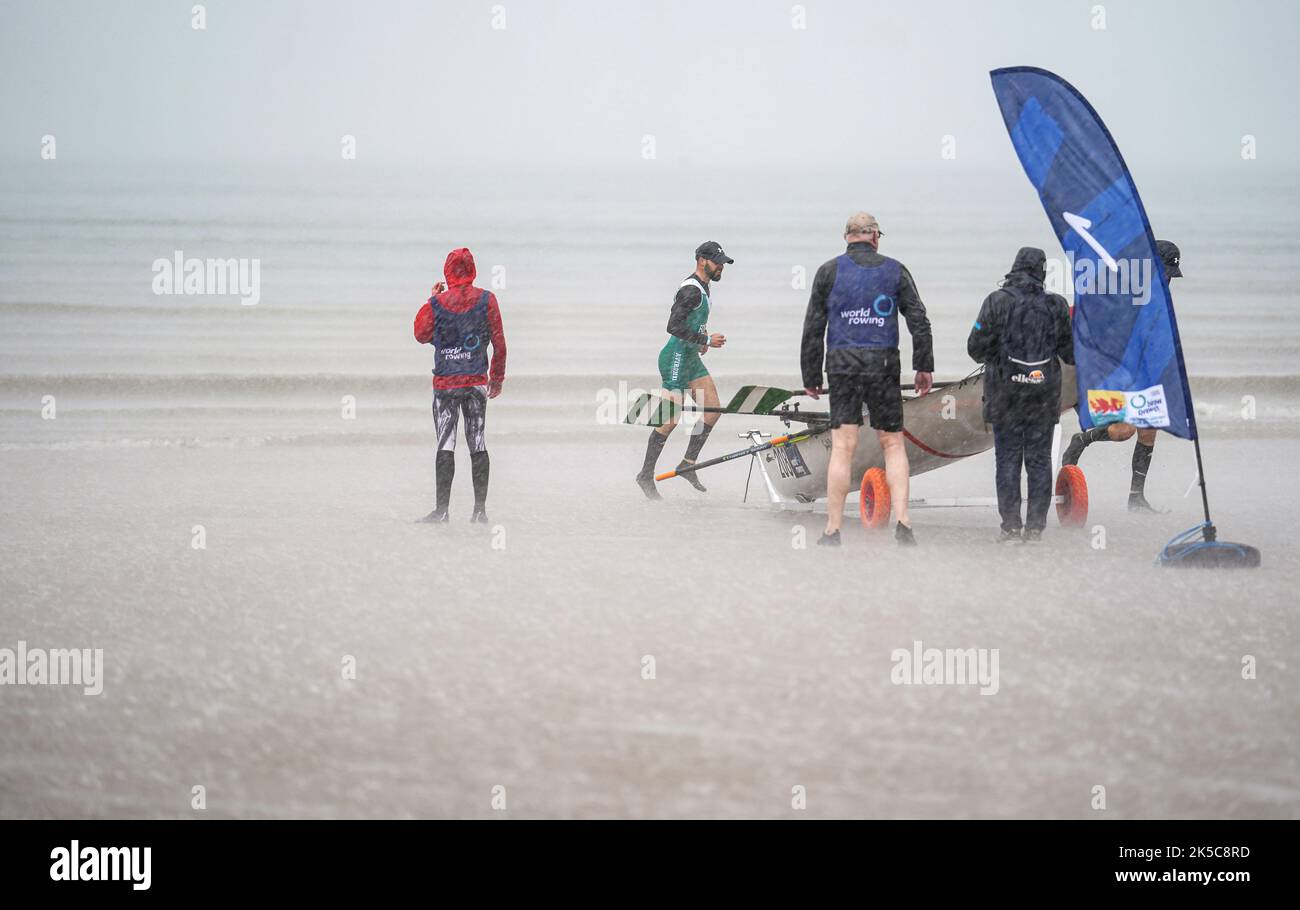 France men's double skull team warms up in a rain storm during the ...