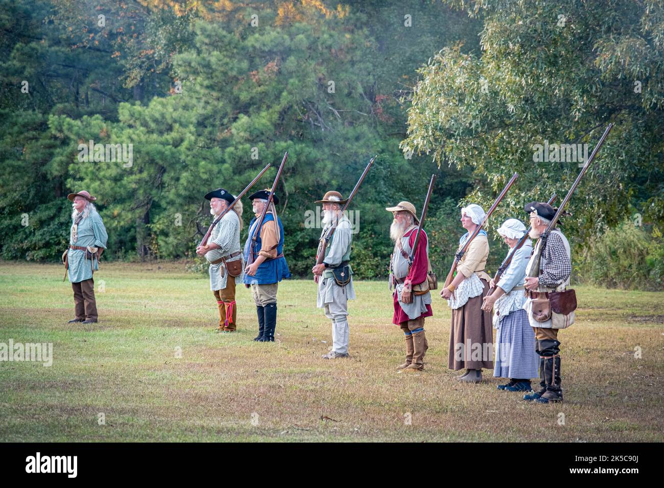 Members of the Overmountain Victory Trail Association stand holding ...