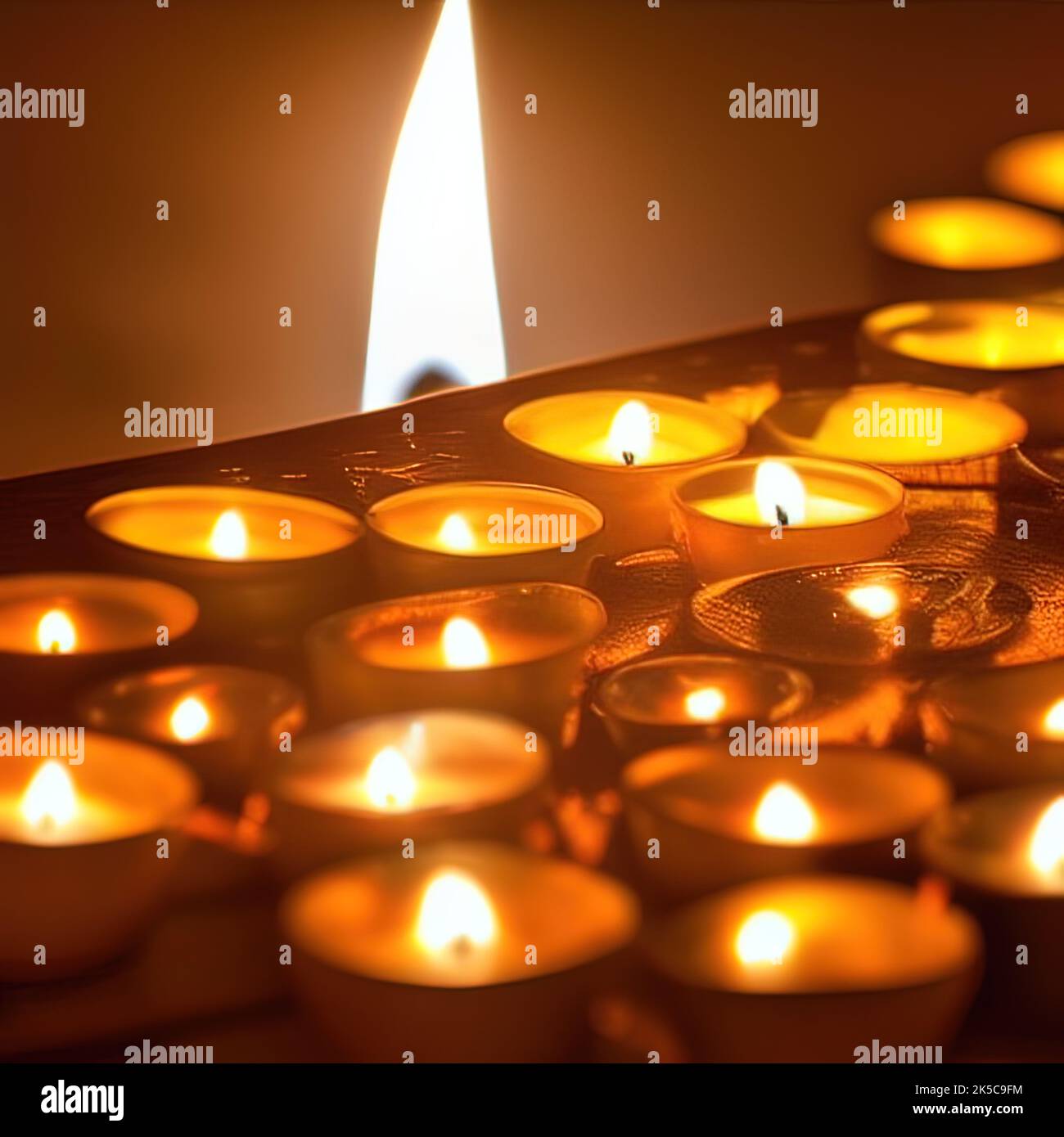 A vertical closeup of burning candles, diyas. Happy Diwali Stock Photo ...