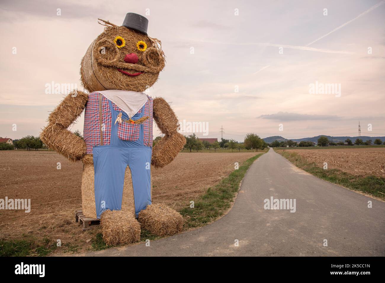 Large figure made of straw bales on the roadside Stock Photo - Alamy