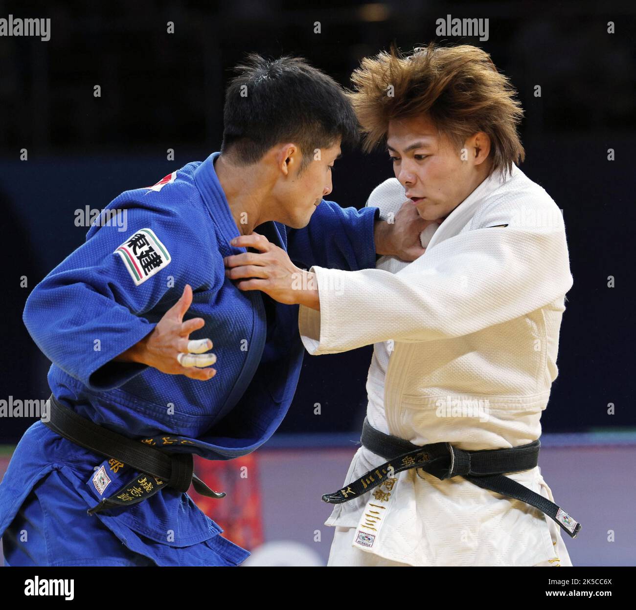 Japan's Hifumi Abe (white) competes against compatriot Joshiro Maruyama ...