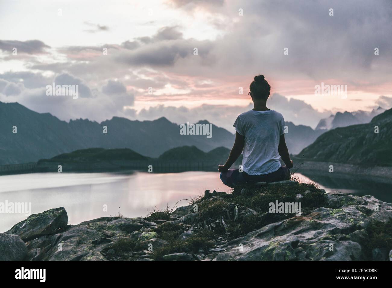 Yoga in the mountains, meditation at sunrise Stock Photo - Alamy