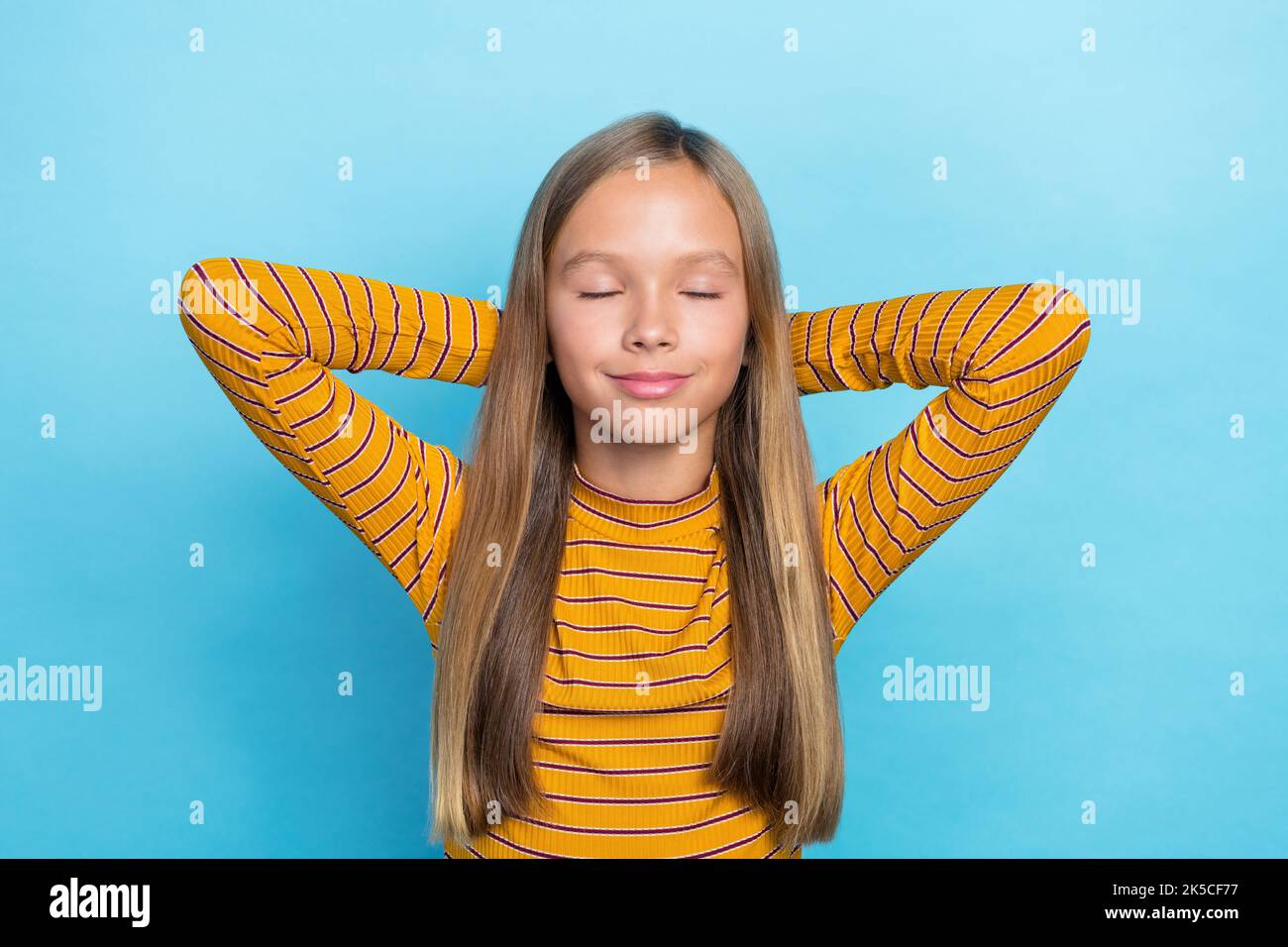 Photo Of Adorable Sweet Girl Closed Eyes Arms Behind Head Take Nap Isolated On Blue Color 