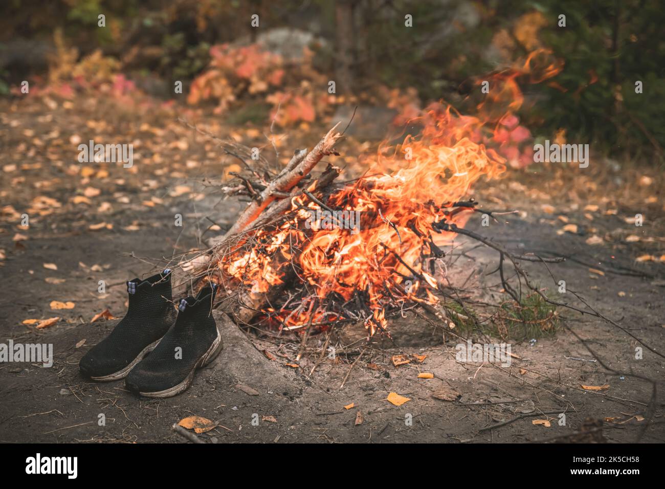 shoes near the campfire, active outdoor recreation, camping, drying ...