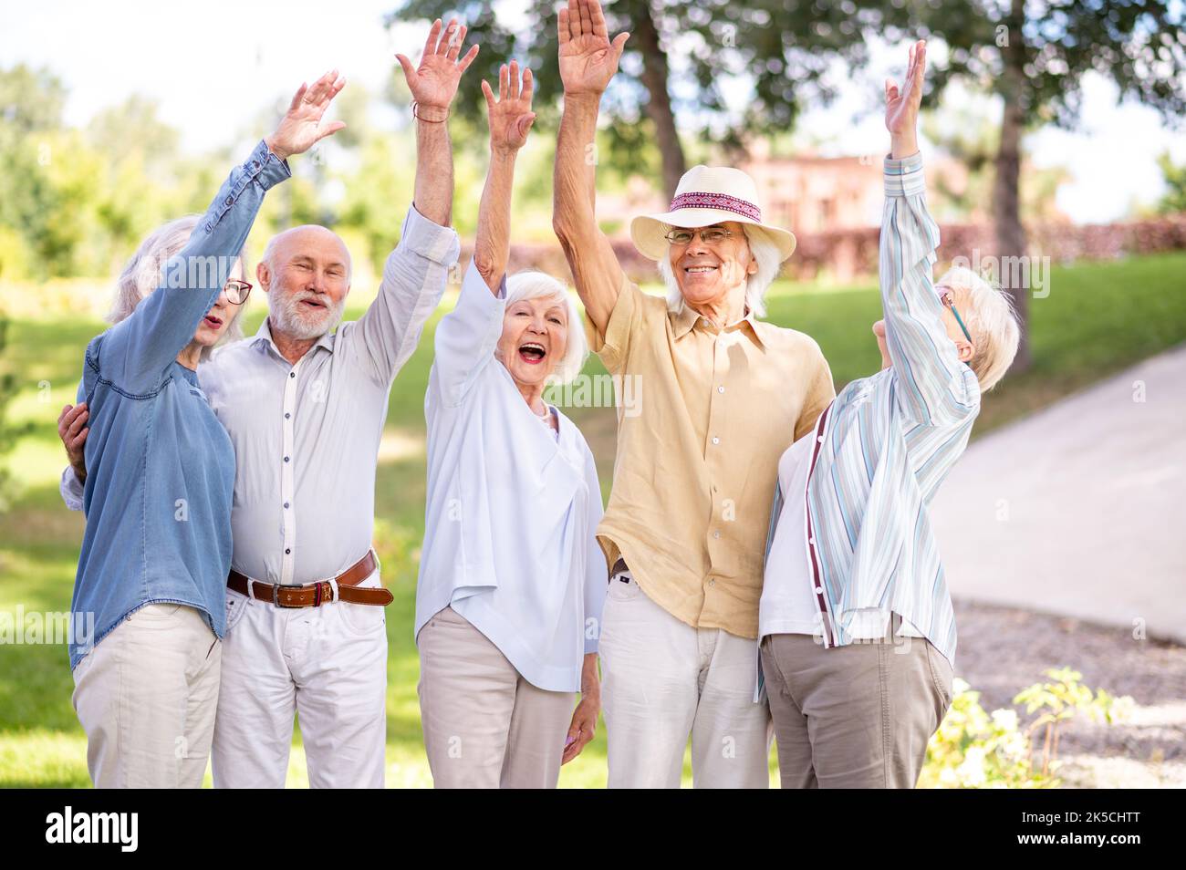 Group of happy elderly people bonding outdoors at the park - Old people ...