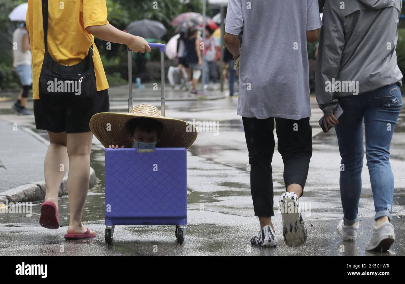A young boy in a dolly on a rainy day in Mei Foo. 30SEP22 SCMP ...