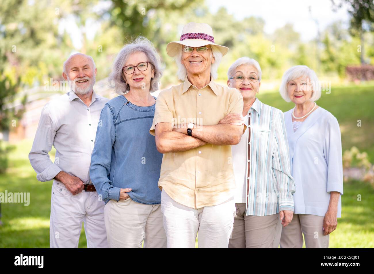 Group of happy elderly people bonding outdoors at the park - Old people ...