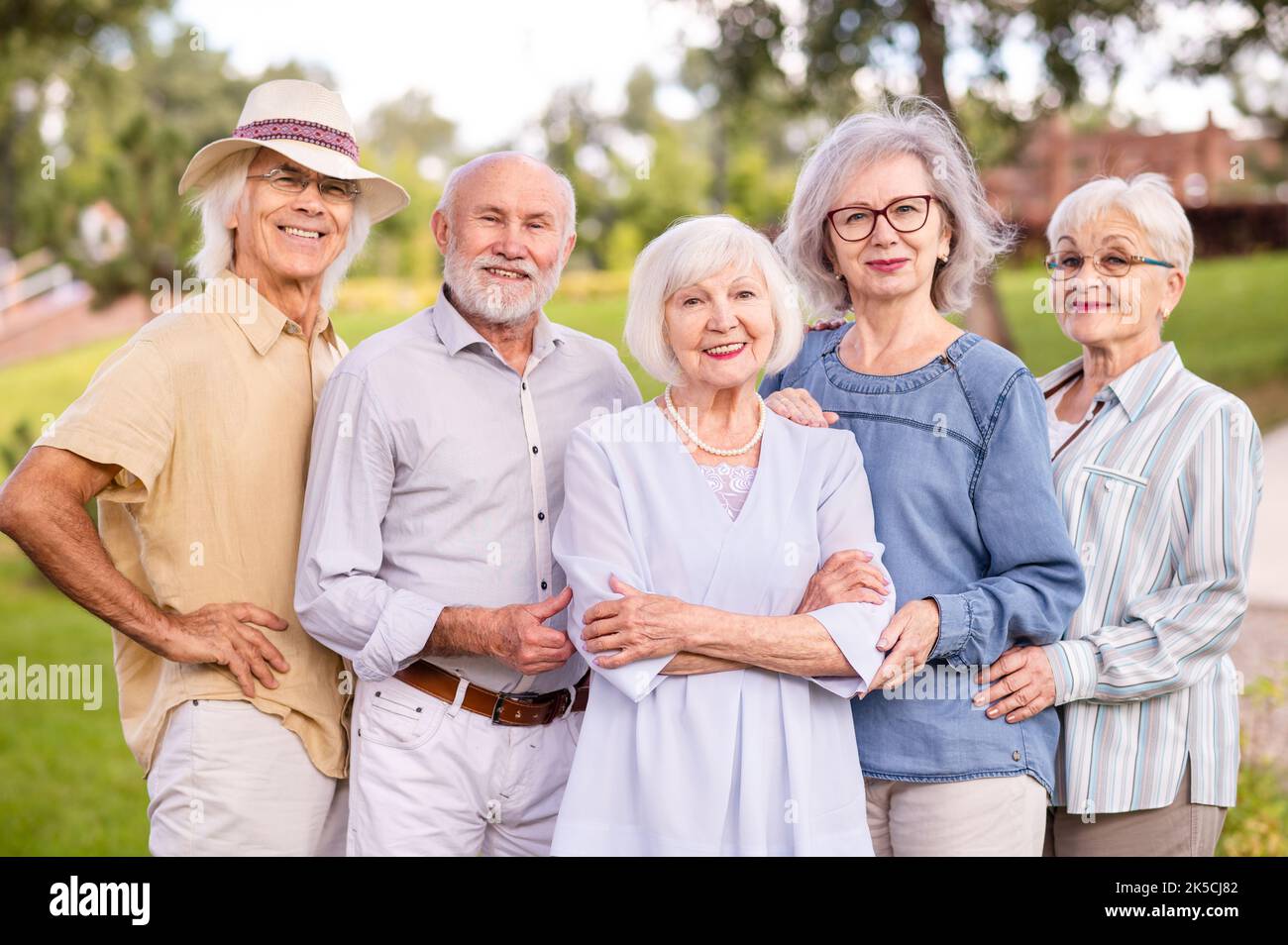 Group of happy elderly people bonding outdoors at the park - Old people ...