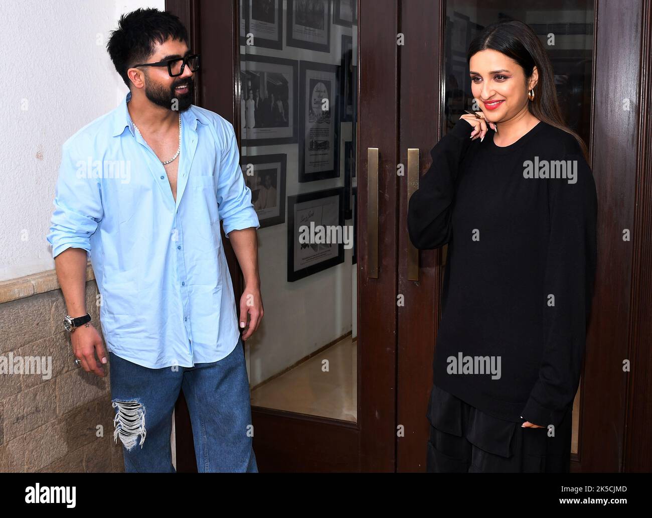 Mumbai, India. 07th Oct, 2022. Bollywood actress Parineeti Chopra (R) smiles as singer and actor ...