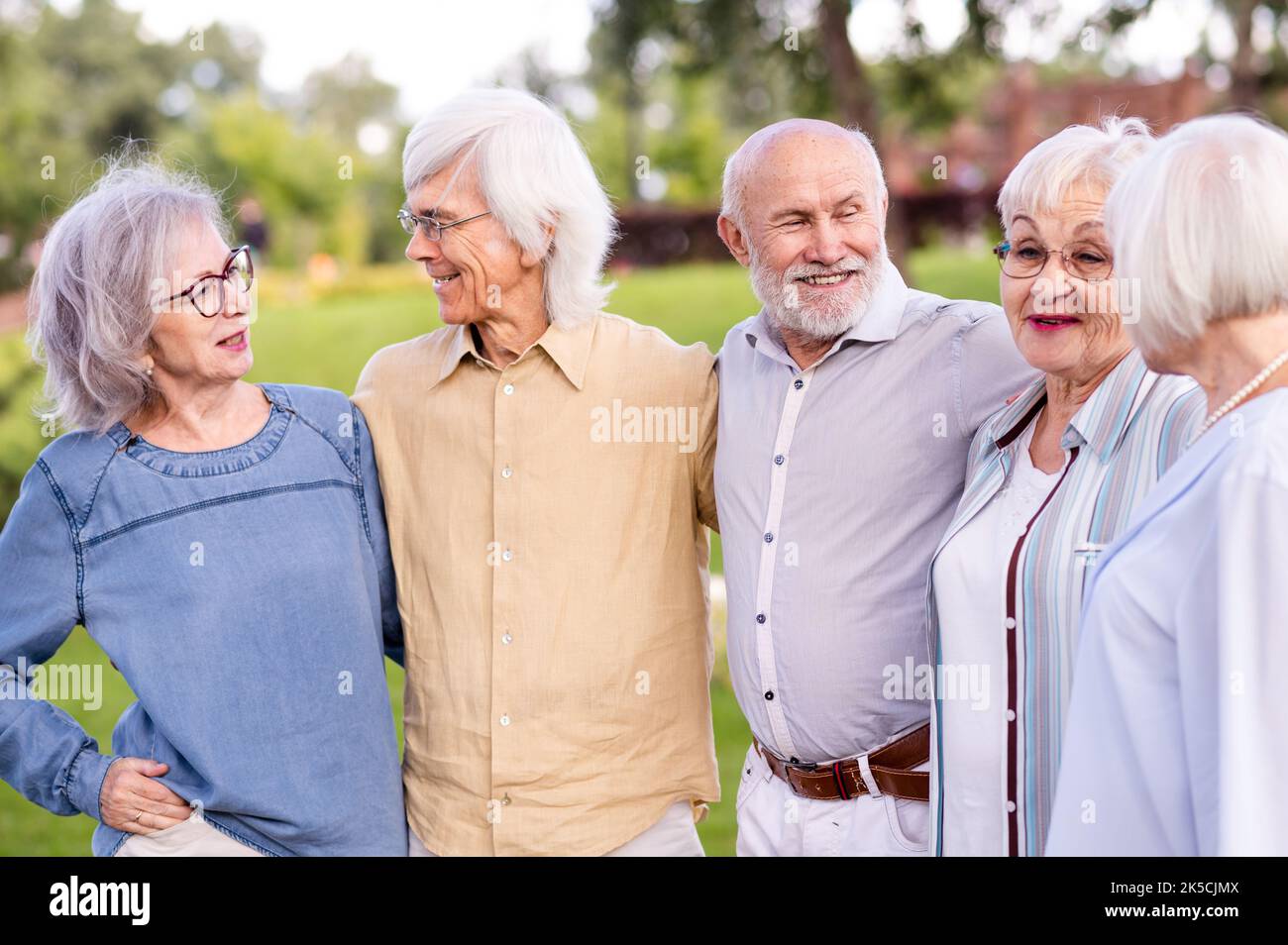 Group of happy elderly people bonding outdoors at the park - Old people ...