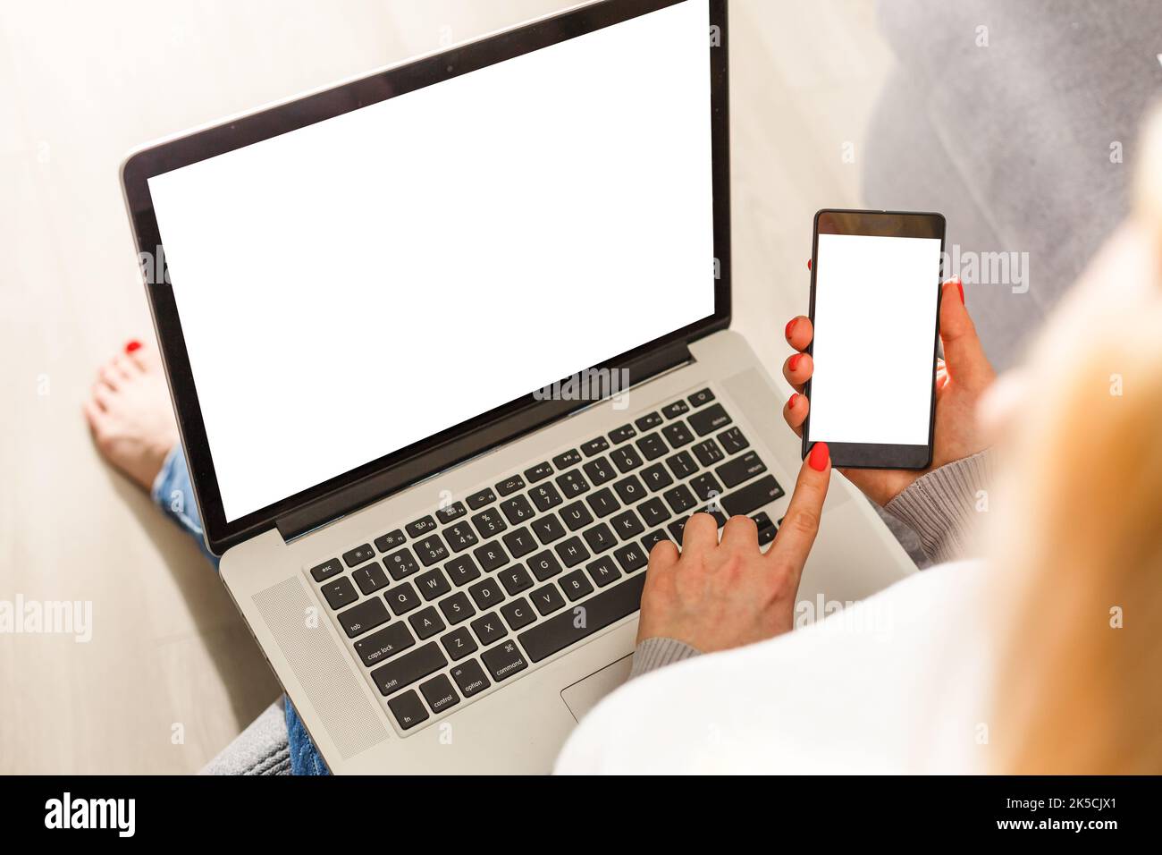 Side view. Young business woman sitting at table and taking notes in ...